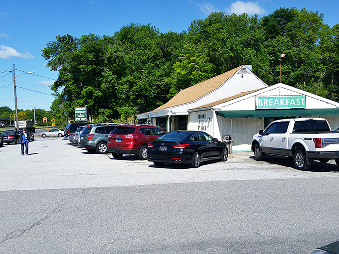Unassuming white building with a simple "BREAKFAST" sign? That's the universal signal for "life-changing eggs ahead." Trust the packed parking lot.