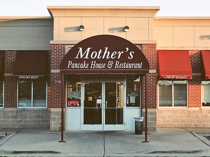 The iconic red awning of Mother's Pancake House beckons hungry diners like a breakfast lighthouse guiding ships to shore.