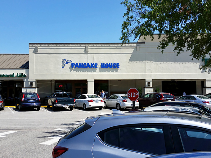 The blue sign beckons like a breakfast lighthouse in a sea of parking spaces. Columbia's morning treasure awaits!