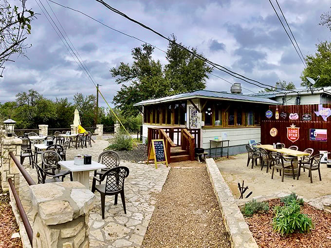 The humble exterior of Alamo Springs Caf&eacute; belies the culinary treasures within. Texas Hill Country magic awaits on this rustic patio.