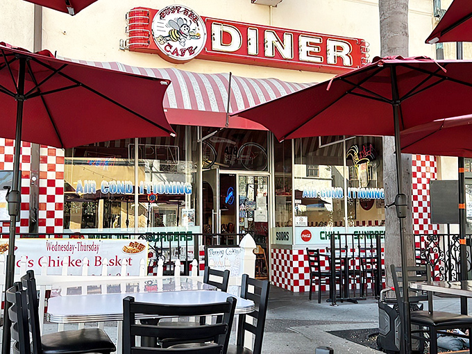 The red and white checkered facade isn't just inviting—it's practically shouting "Get in here and eat something wonderful!" Classic Americana at its finest.