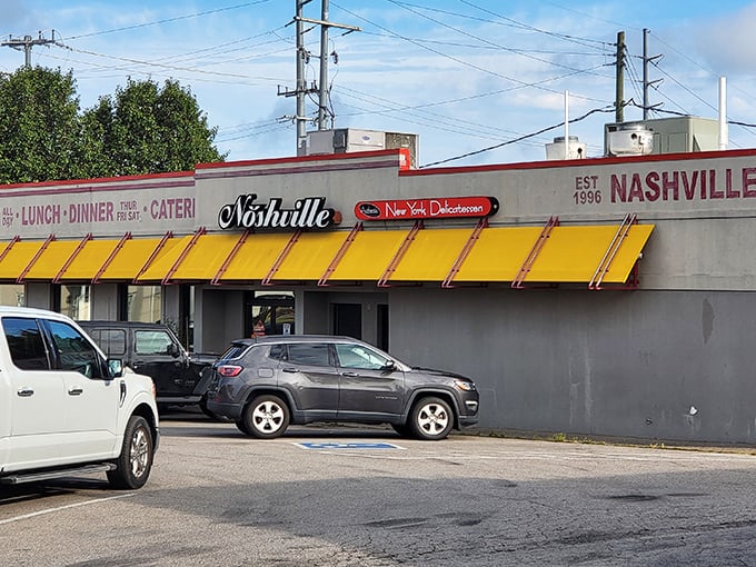 That bright yellow awning beckons like a beacon of comfort food hope in Nashville's bustling landscape.