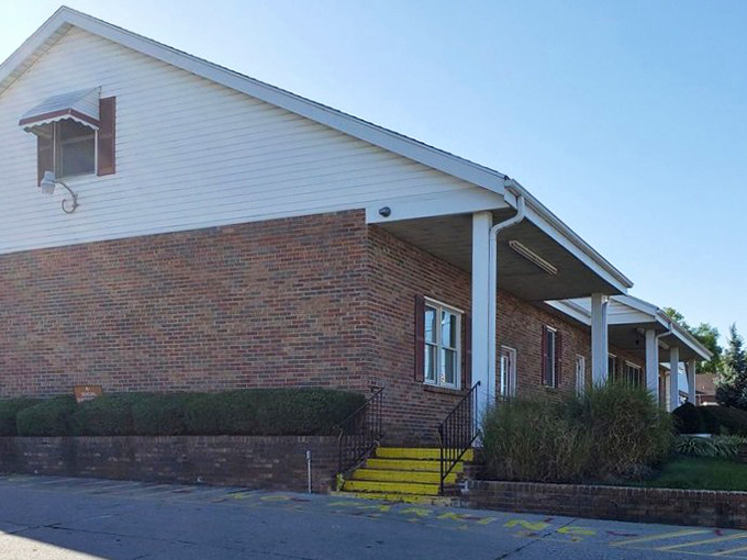 The unassuming brick exterior of Bill's Donut Shop stands like a temple to fried dough, promising sweet salvation to all who enter.