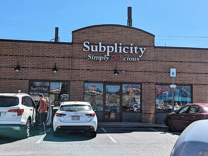 The brick facade of Subplicity stands like a sandwich sanctuary in Breezewood, promising "Simply Delicious" experiences for hungry travelers seeking refuge from turnpike tedium.