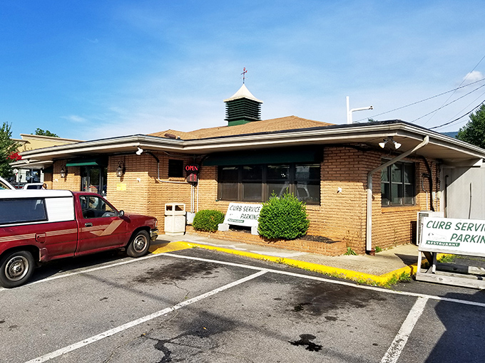 The green facade and classic script welcome you like an old friend. This unassuming entrance hides a treasure trove of Southern comfort.
