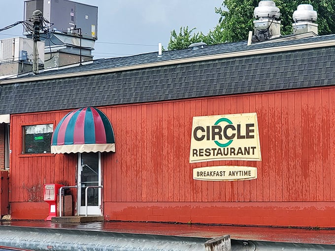 The bright red exterior of Circle Restaurant stands like a culinary lighthouse in Deerfield, promising "BREAKFAST ANYTIME" to hungry travelers seeking refuge.