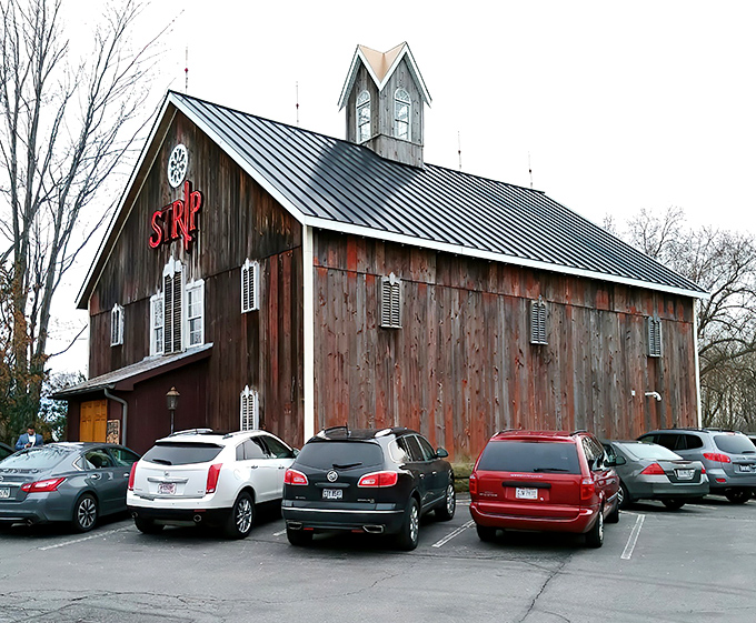 The rustic barn exterior of Strip Steakhouse stands as a delicious contradiction&mdash;fine dining hiding in plain sight among Avon's countryside charm.