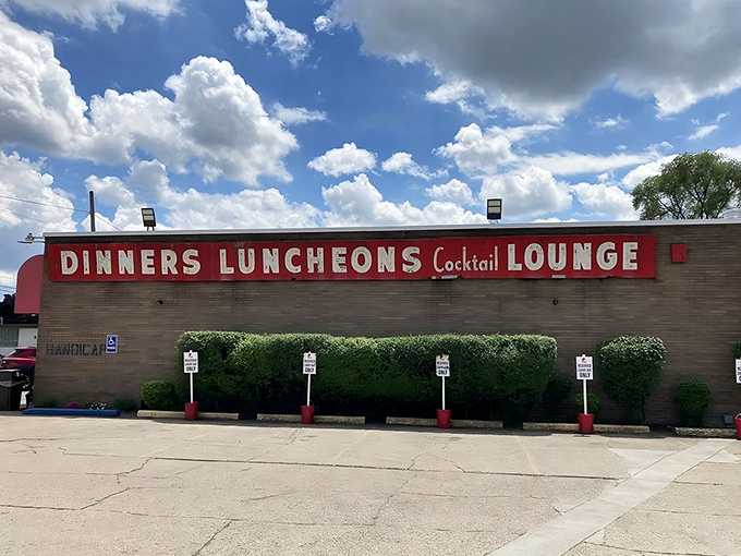 The unassuming exterior hides culinary greatness like a superhero's secret identity. This brick building houses Detroit pizza royalty.