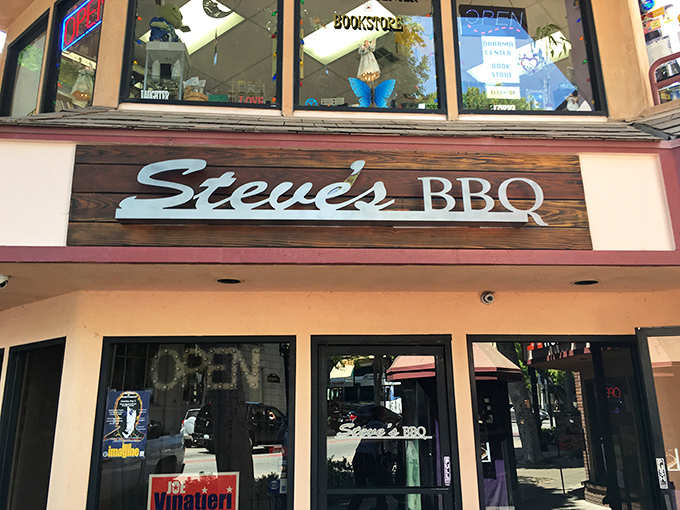 Steve's BBQ announces itself with understated confidence – a wooden sign that promises authenticity without the flash. Good barbecue never needs to shout.
