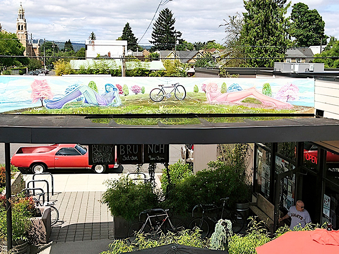 Radio Room's exterior perfectly preserves its 1949 gas station bones while promising something far more delicious than unleaded. The illuminated sign becomes Portland's culinary lighthouse after dark.