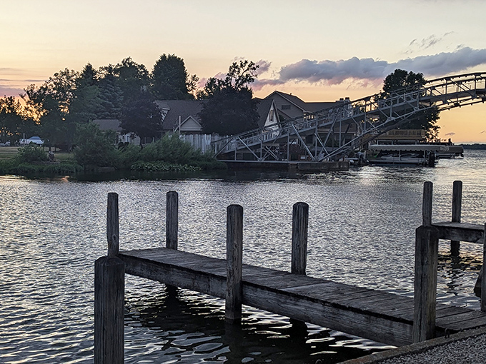 Nature's perfect mirror: this stone pathway stretches into Indian Lake's crystal waters, inviting explorers to venture just a bit further into the blue beyond.