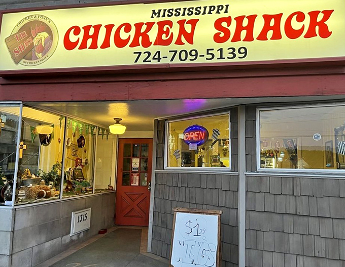 The unassuming exterior of Mississippi Chicken Shack might not stop traffic, but that red door is basically a portal to flavor paradise.