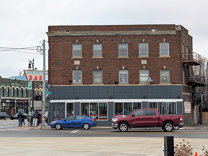 Detroit's Corktown neighborhood hides this brick-clad treasure with its iconic vintage sign and whimsical red bull sculpture. Burgers await inside!