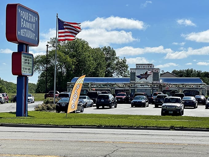The iconic red, white, and blue sign beckons hungry travelers like a patriotic lighthouse guiding ships to the shore of breakfast bliss.