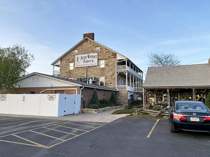 The Jean Bonnet Tavern stands proudly against the Pennsylvania sky, its sturdy stone walls having witnessed centuries of American history while patiently waiting for your dinner reservation.