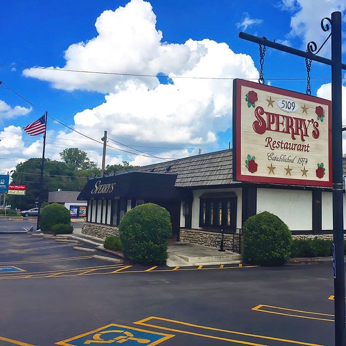 The iconic Tudor-style exterior of Sperry's stands like a culinary lighthouse in Belle Meade, beckoning hungry Nashvillians with its distinctive red and white sign.