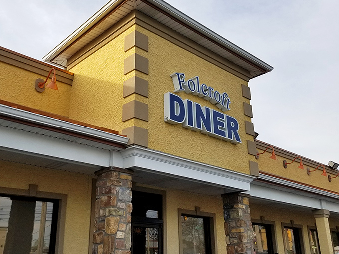The Folcroft Diner glows like a beacon of comfort food hope at dusk, its warm lights promising delicious refuge from the daily grind.