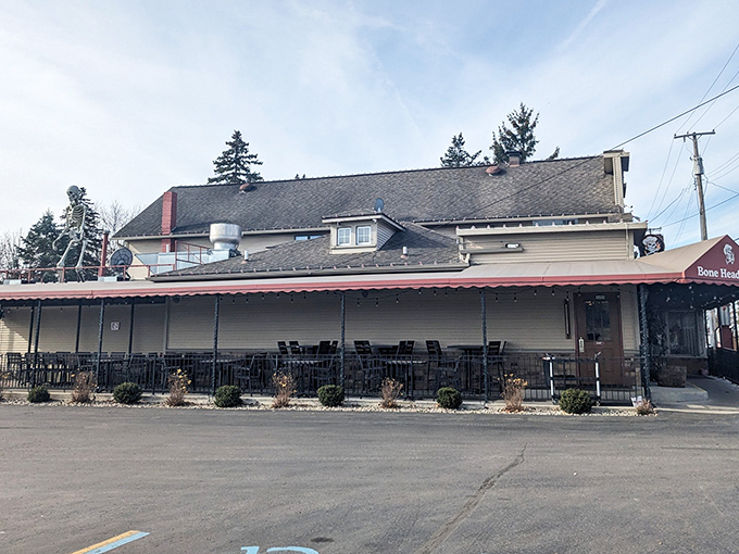 The sun sets behind Bone Heads BBQ like nature's own spotlight, highlighting this unassuming treasure that's been turning Willis, Michigan into a barbecue destination.