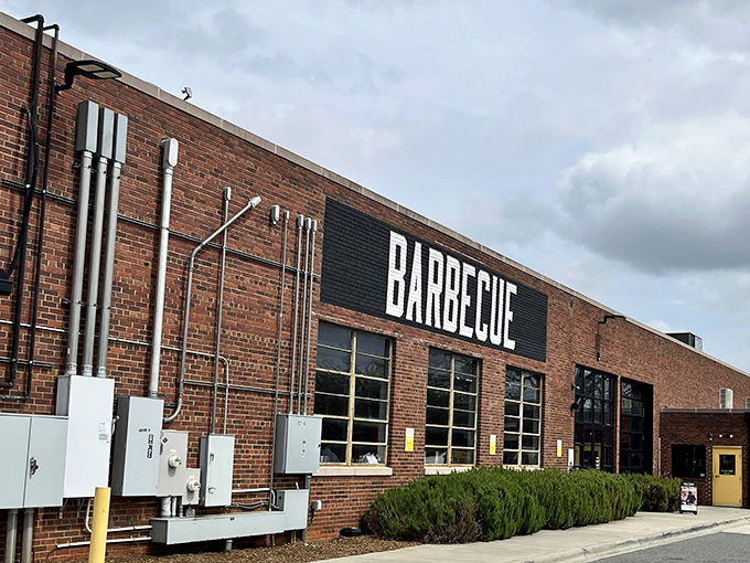 The bold "BARBECUE" declaration on this brick fortress isn't just signage&mdash;it's a promise that's kept with every smoky bite inside.