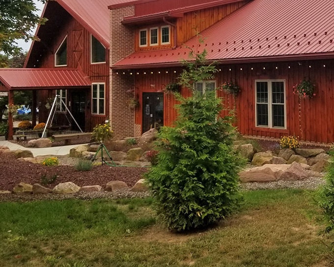 Rustic barn meets barbecue paradise – Stampede's timber-framed exterior promises smoke-kissed treasures within, like a wooden invitation to meat heaven.