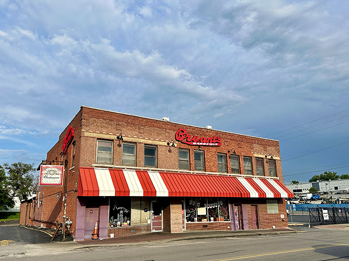 That iconic red script against brick isn't just a sign&mdash;it's a beacon calling barbecue pilgrims to one of Kansas City's most hallowed smoke temples. 