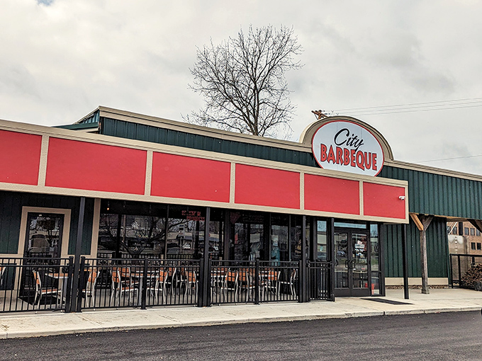 The red and green exterior of City Barbeque stands like a beacon of smoky promise. No fancy frills needed when what's inside speaks volumes.
