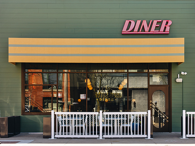 The cheerful yellow exterior of Little Goat Diner stands out like a beacon of breakfast hope on Chicago's restaurant row.