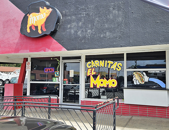 The iconic yellow pig logo beckons hungry travelers like a porcine North Star, guiding carnitas pilgrims to their delicious destination.