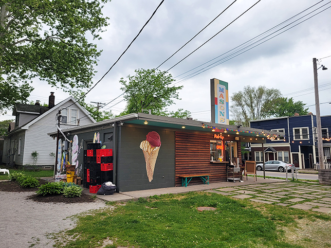 Mason's Creamery stands like a sweet oasis in Cleveland's Ohio City neighborhood, its colorful sign promising frozen delights under string lights and summer skies.