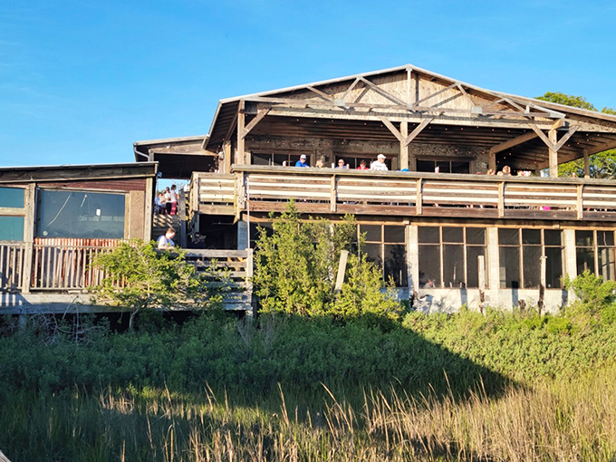 Rustic charm meets coastal magic at Bowens Island Restaurant, where this weathered wooden structure has survived hurricanes and hungry crowds with equal resilience.