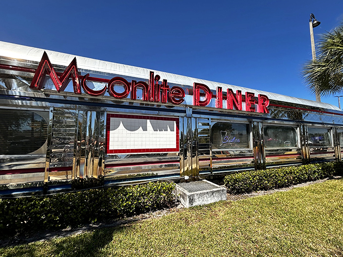 Chrome gleaming in the Florida sunshine, Moonlite Diner's exterior promises a time-traveling feast. This isn't just a restaurant&mdash;it's a shiny portal to simpler times. 
