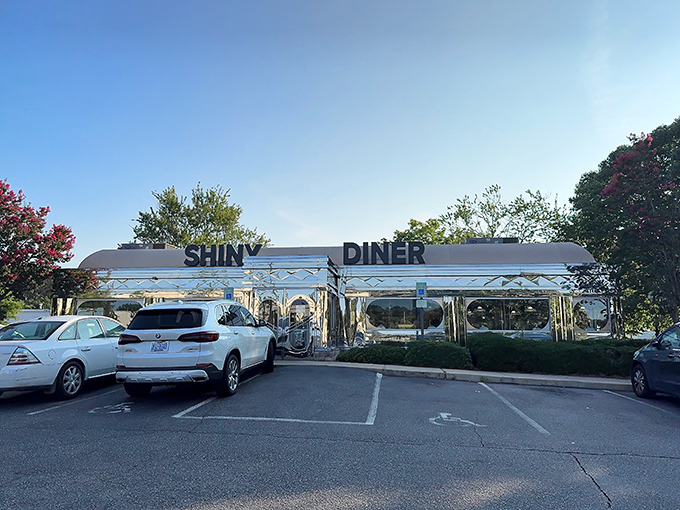 Like a chrome time machine parked on Buck Jones Road, The Shiny Diner's gleaming exterior promises nostalgic delights before you even step inside. 