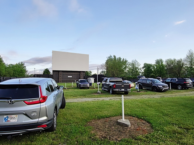 Cars lined up facing the massive white screen, where memories are made under Indiana skies. The perfect blend of nostalgia and modern movie magic.