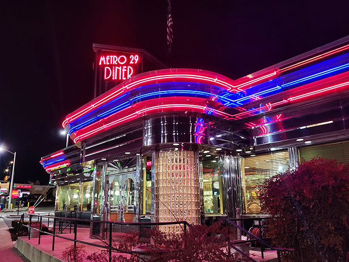 The neon-trimmed exterior of Metro 29 Diner glows like a beacon of hope for the hungry, a chrome-clad time machine promising comfort food salvation.