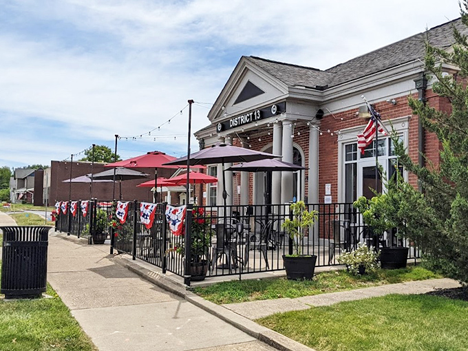 The architectural equivalent of a firm handshake &ndash; District 13's brick exterior with white columns promises small-town charm with big-city flavors waiting inside.