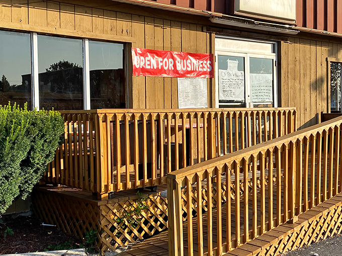 The unassuming wooden exterior of Sandwich Man might not scream "culinary destination," but locals know this humble facade hides sandwich greatness within.