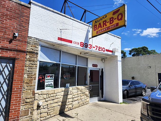 The bright yellow sign beckons like a culinary lighthouse in Detroit. This is where BBQ dreams and fried shrimp fantasies come true.
