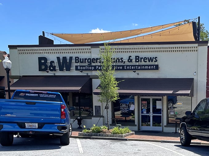 The unassuming exterior of B&W Burgers, Buns, & Brews in Norcross hides culinary treasures that would make any food detective proud.