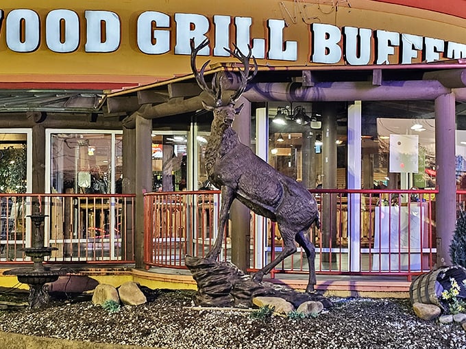 The majestic deer statue stands guard outside Wood Grill Buffet like a woodland bouncer saying, "Yes, there's plenty of food inside."