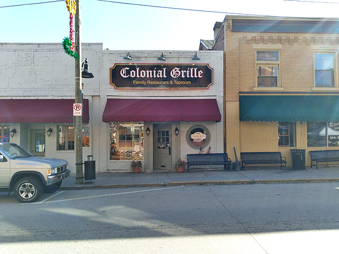 The classic brick fa&ccedil;ade and red awnings of Colonial Grille stand as a beacon of breakfast hope on Irwin's Main Street, promising comfort food salvation to hungry travelers.