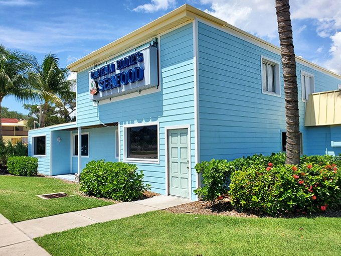 The cheerful blue exterior of Captain Eddie's stands like a tropical oasis in Nokomis, promising seafood treasures that locals have treasured for years.