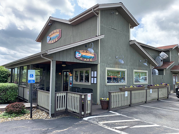 The unassuming exterior of Out of the Fire Cafe hides culinary treasures within, like finding a Michelin-worthy meal in a cozy mountain cabin.