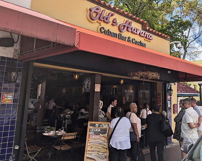 The yellow facade of Old's Havana beckons like a warm tropical embrace, promising authentic Cuban flavors on Miami's vibrant Calle Ocho.