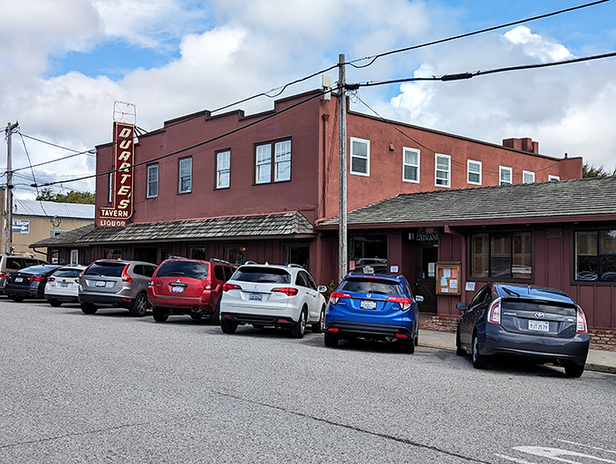 The brick-red exterior of Duarte's Tavern stands like a culinary lighthouse on Pescadero's main drag, beckoning hungry travelers with its vintage neon sign.