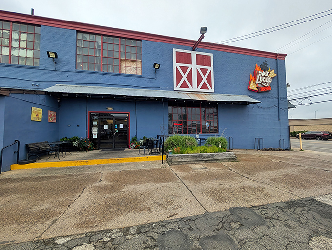 The bright blue exterior of Sweet Lucy's stands out like a barbecue beacon in Northeast Philly, complete with barn-style red accents.