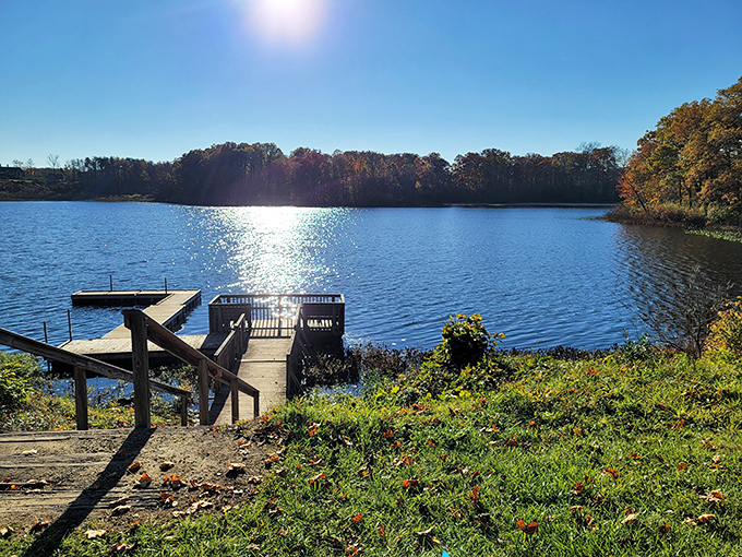 Nature's perfect mirror &ndash; Punderson Lake reflects autumn's fiery palette while boat docks patiently wait for the next adventure seeker.