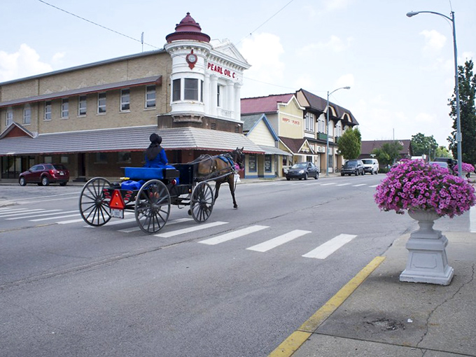 Where horse-drawn buggies and historic storefronts collide &ndash; Berne's main street offers a glimpse into a simpler time while vibrant flower displays add splashes of color.