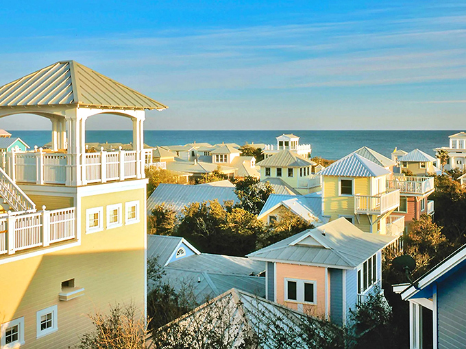 Pastel perfection meets coastal charm in Seaside's iconic architecture. Those metal roofs gleaming in the sunshine are practically begging for a postcard moment.