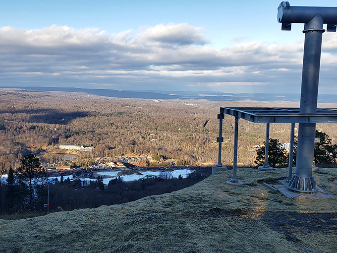 The summit building stands proud against blue skies, like a mountain's crown jewel waiting to share its secrets.