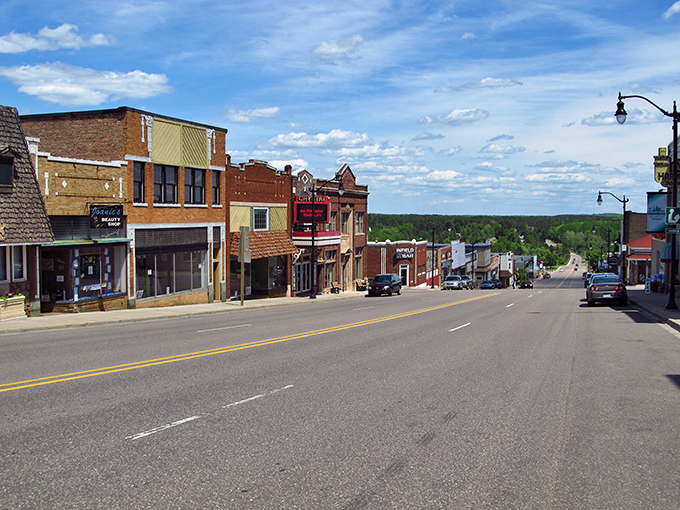 Superior Avenue stretches into the distance like a postcard from simpler times, framed by forests that seem to whisper, "Slow down, you're home now."